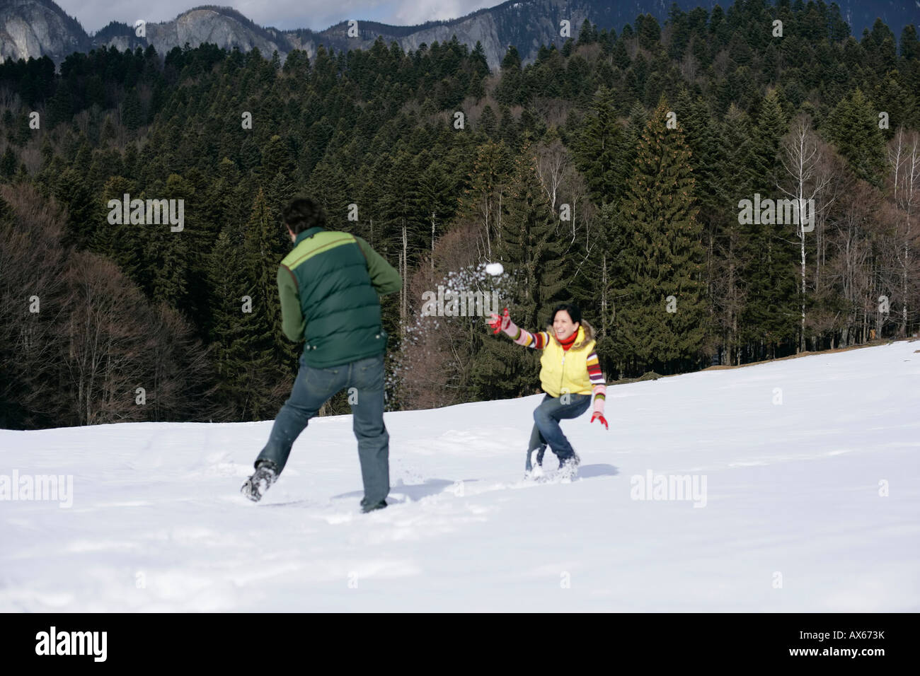 A couple have a snowball fight hi-res stock photography and images - Alamy