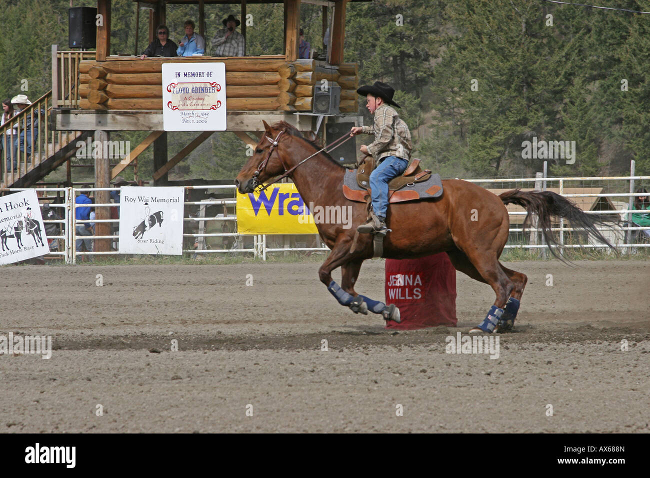 Young boy barrel racing at a rodeo Stock Photo - Alamy