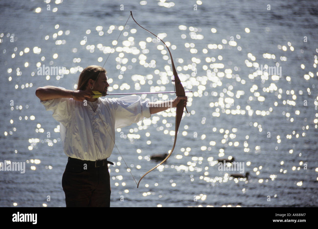 Using bow to shoot arrows hi-res stock photography and images - Alamy