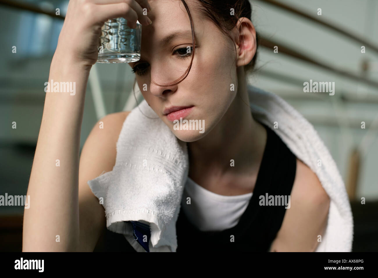 Exhausted female ballet dancer cooling her forehead Stock Photo - Alamy