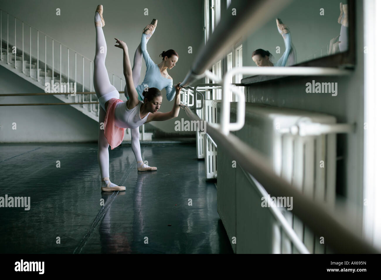 Female ballet dancers doing exercising at a ballet bare Stock Photo - Alamy
