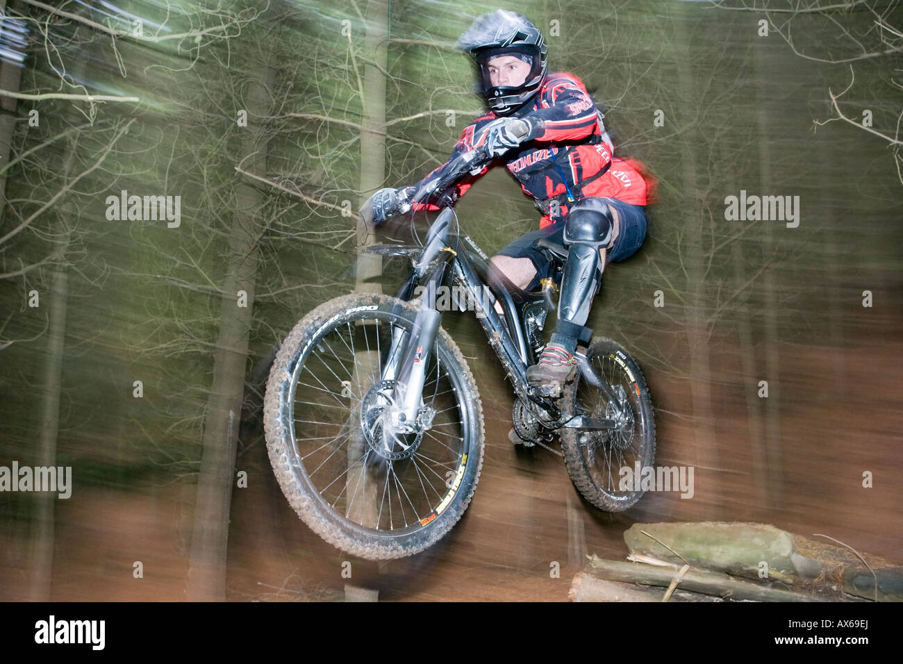 Mountain biker mid air forest hi-res stock photography and images - Alamy