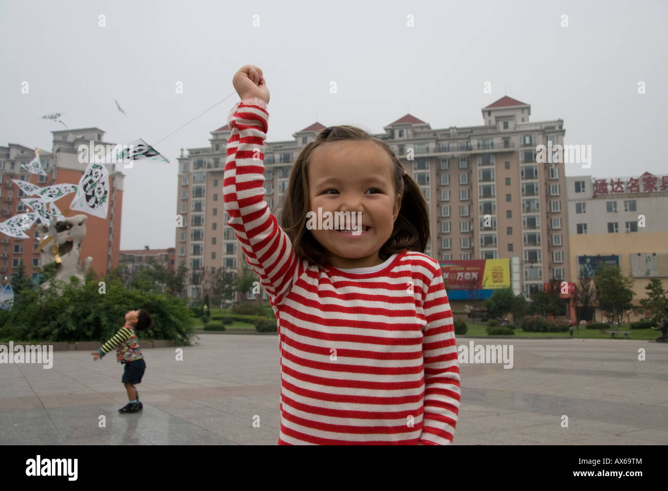 Chinese children fly kite Stock Photo - Alamy