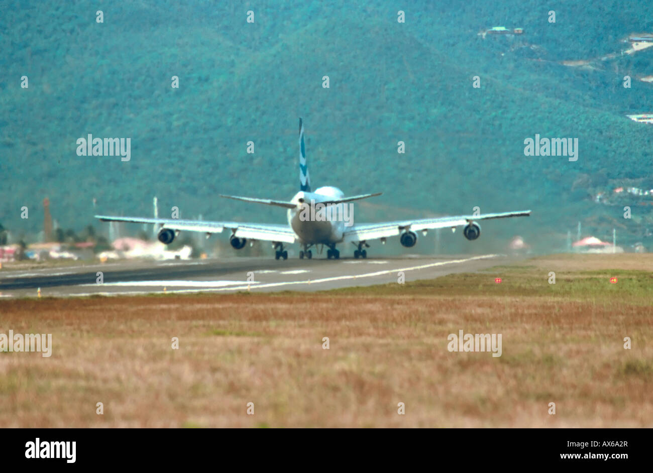 Airplane take off on runway of St. Maarten Stock Photo - Alamy