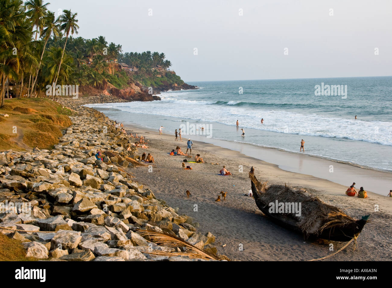 Fishing Boat and Tourists on Beach in Varkala South India Stock Photo ...