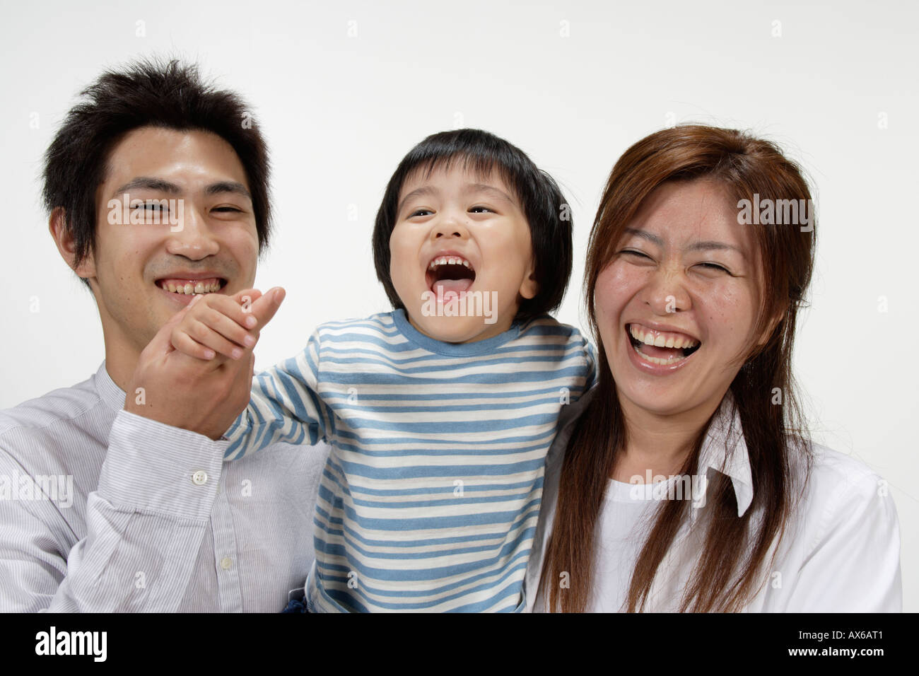 A young couple with a child Stock Photo - Alamy