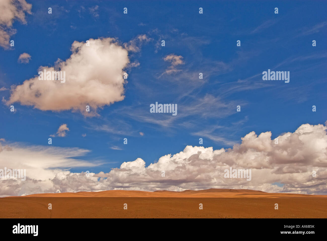 desert landscape white clouds and deep blue sky Stock Photo - Alamy