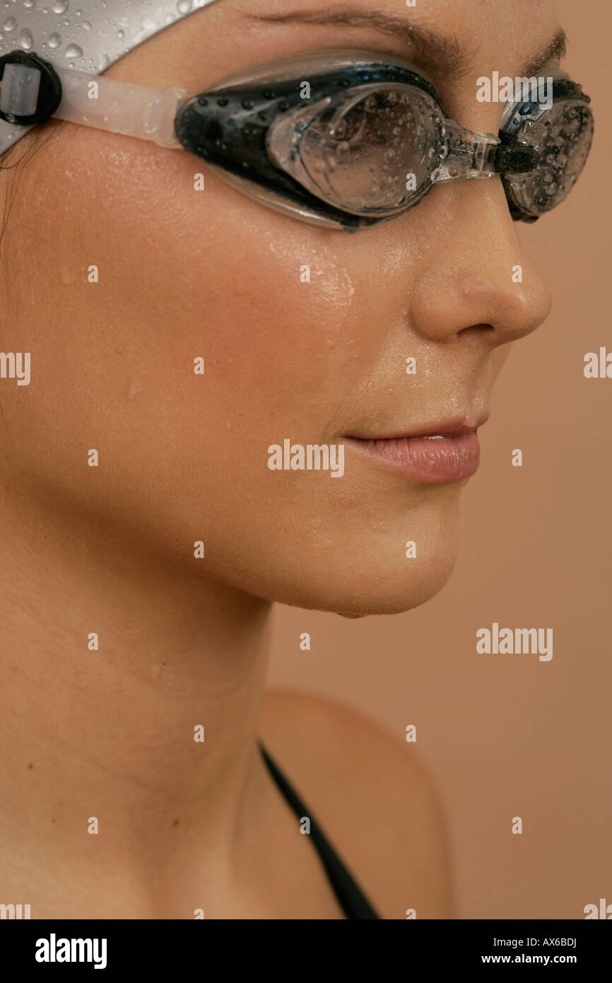 Portrait of a female swimmer with goggles Stock Photo - Alamy
