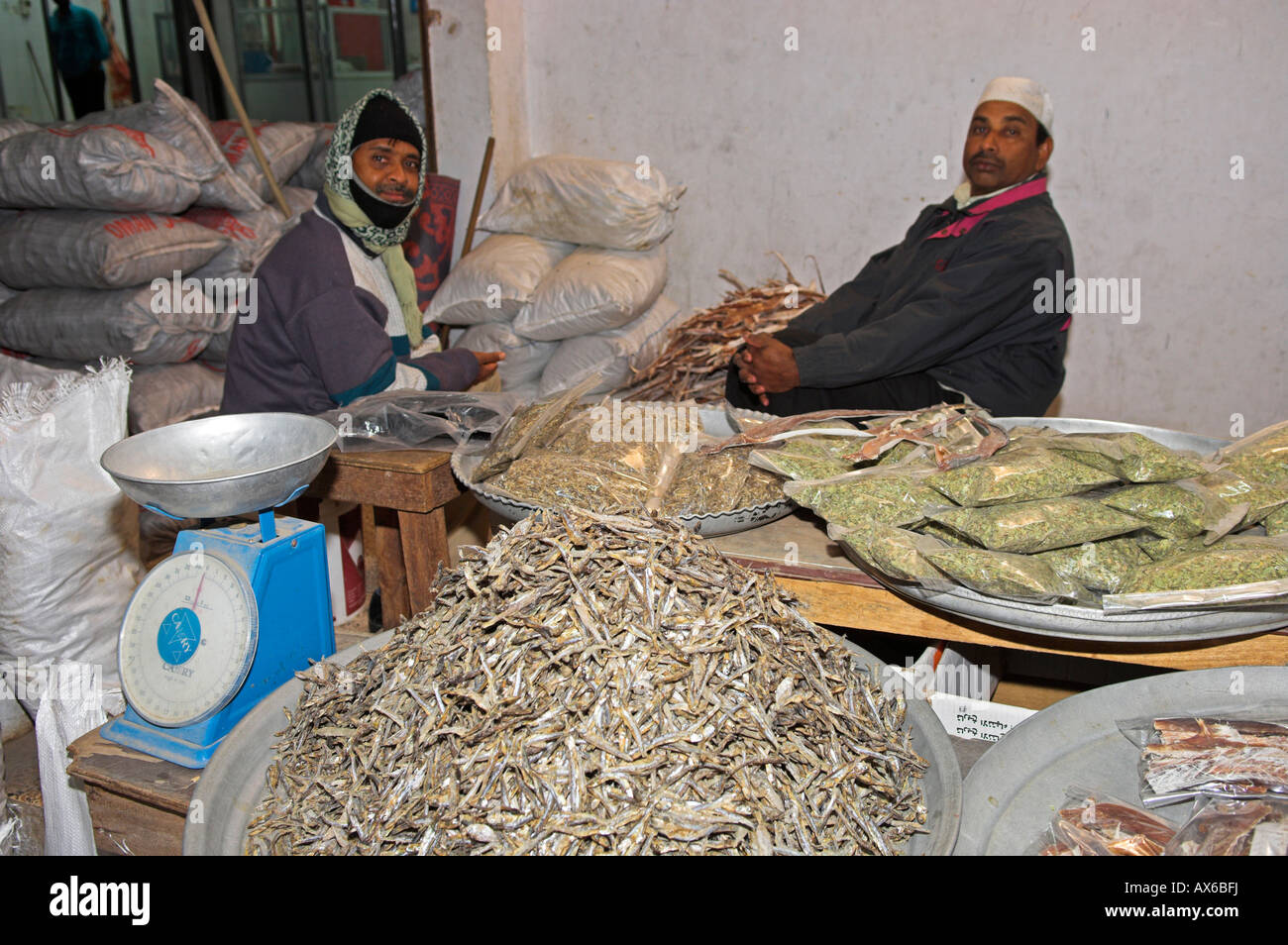 Two men in "dried fish" stall with a souk night Muscat Oman Stock Photo ...