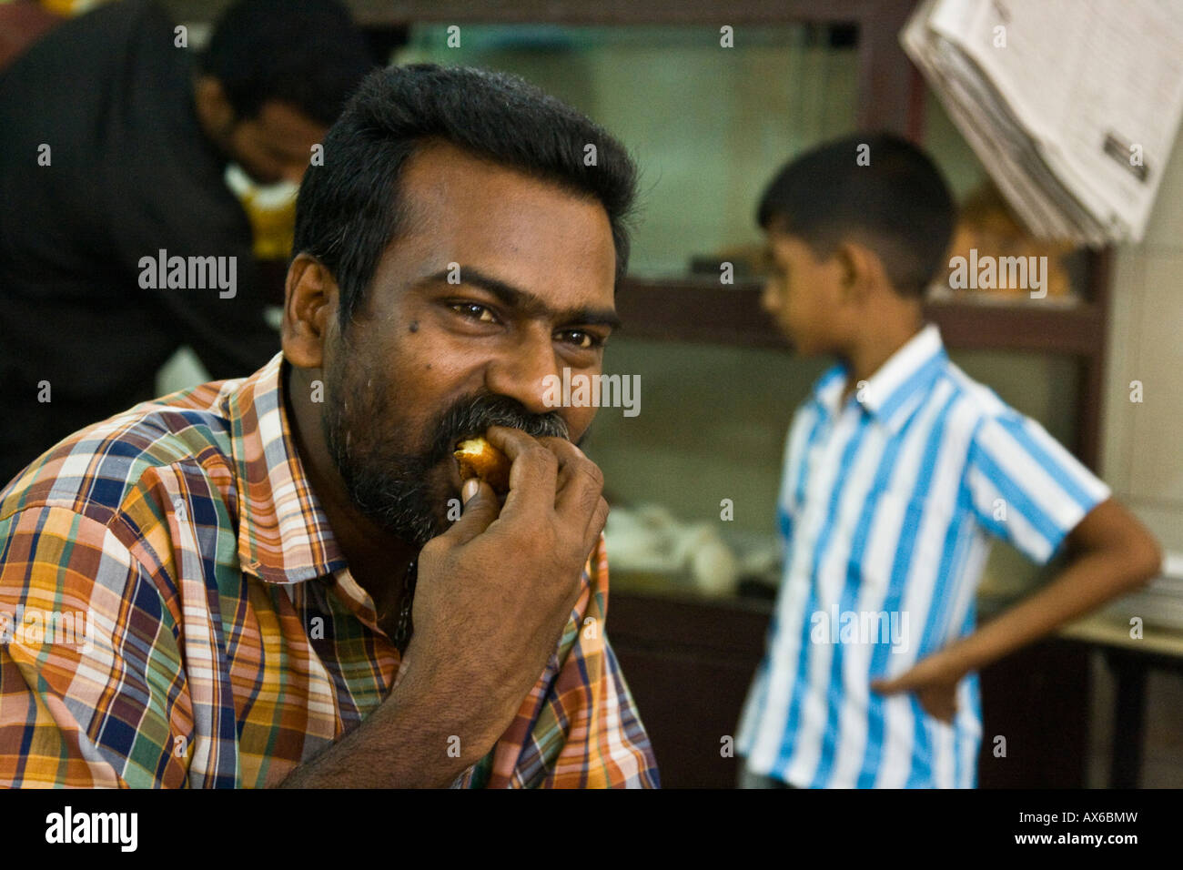 South indian man eating food hi-res stock photography and images - Alamy