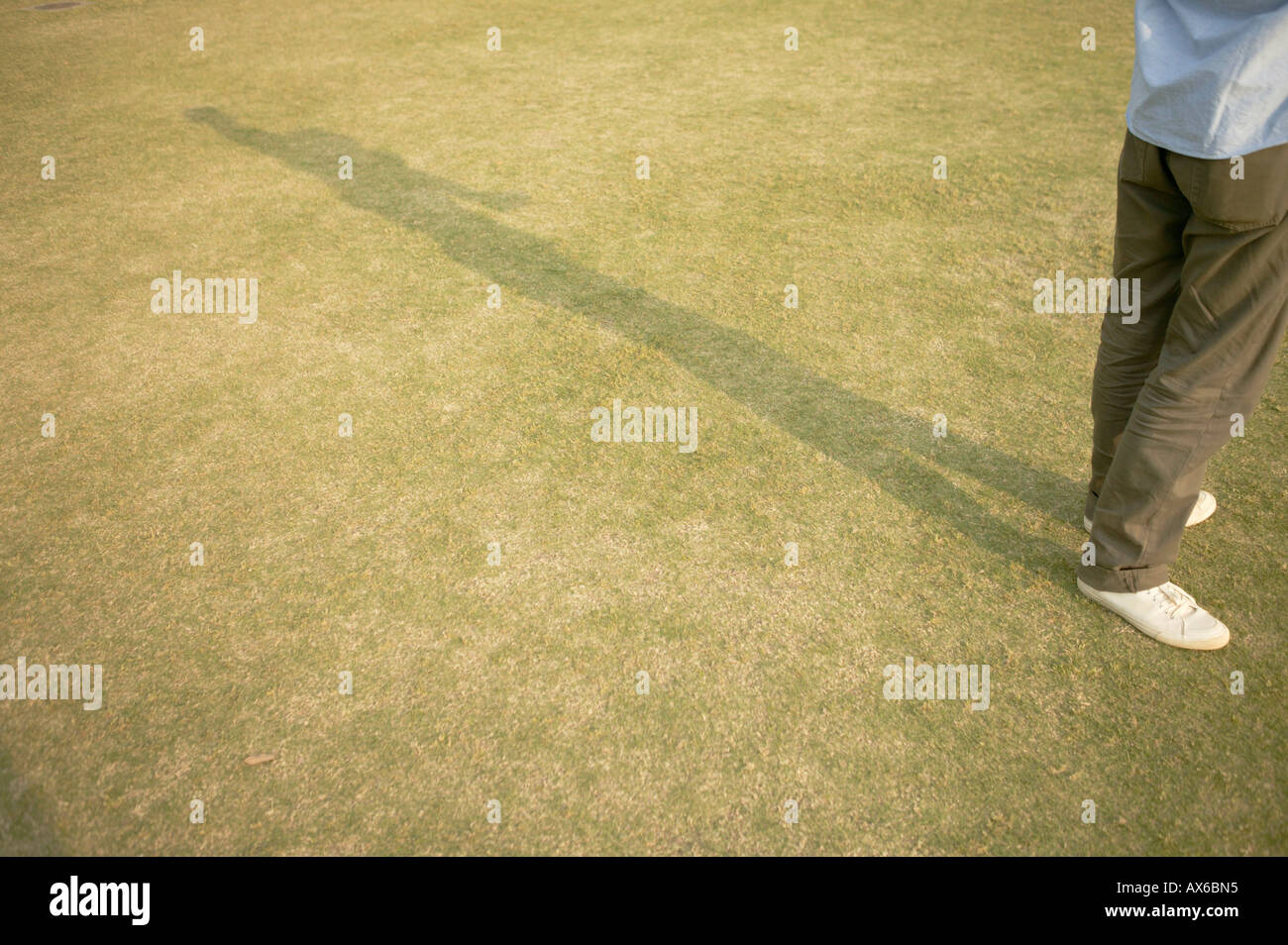 Legs of a man seen standing on the ground Stock Photo - Alamy