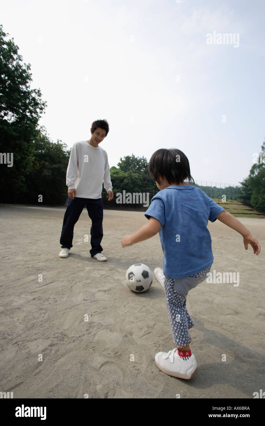 Black father son playing football hi-res stock photography and images ...