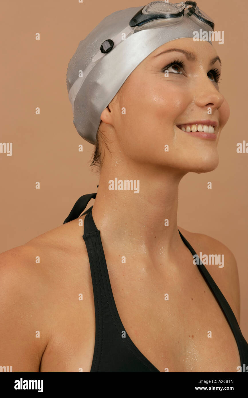A female swimmer wearing a bathing cap and goggles Stock Photo - Alamy