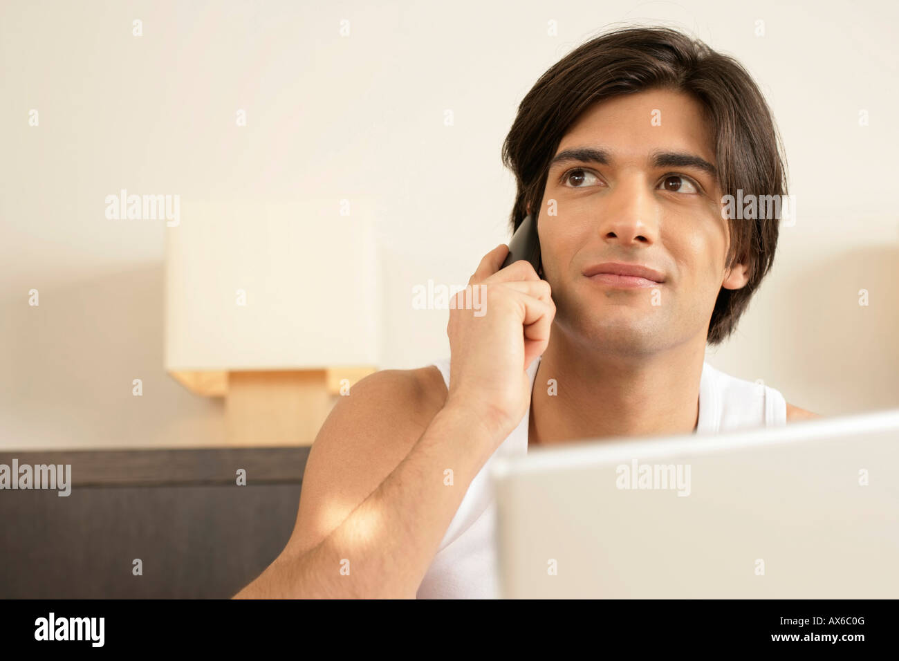Young man phoning Stock Photo - Alamy