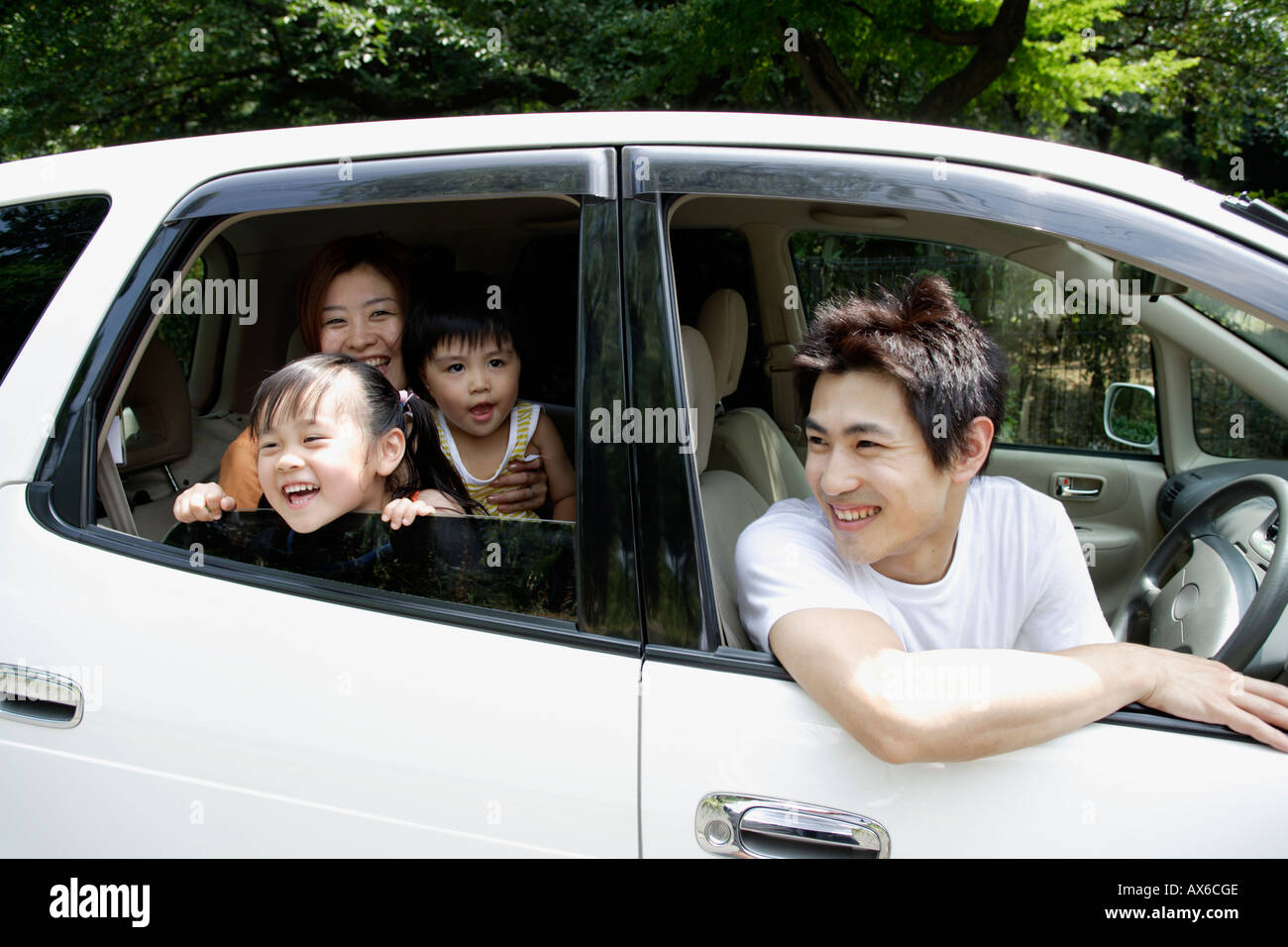 A family in a car Stock Photo - Alamy