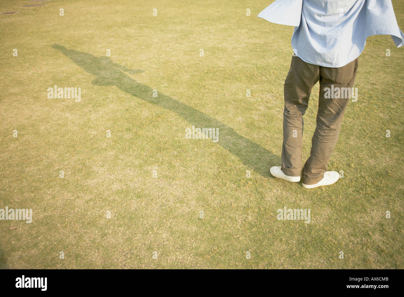 Legs of a man seen standing on the ground Stock Photo - Alamy