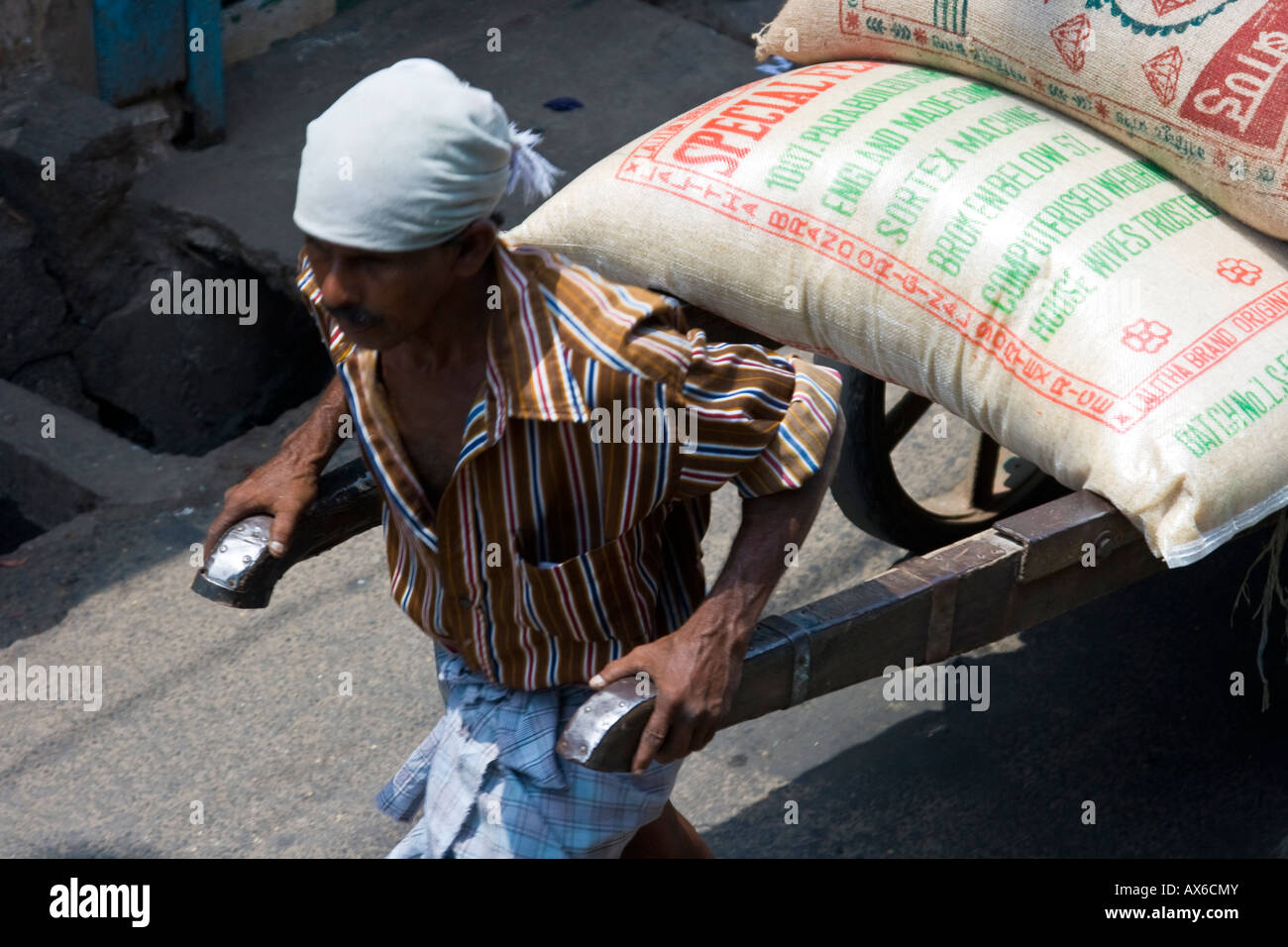 Man Hauling Sacks of Grain on a Cart in Mattancherry in Cochin India ...