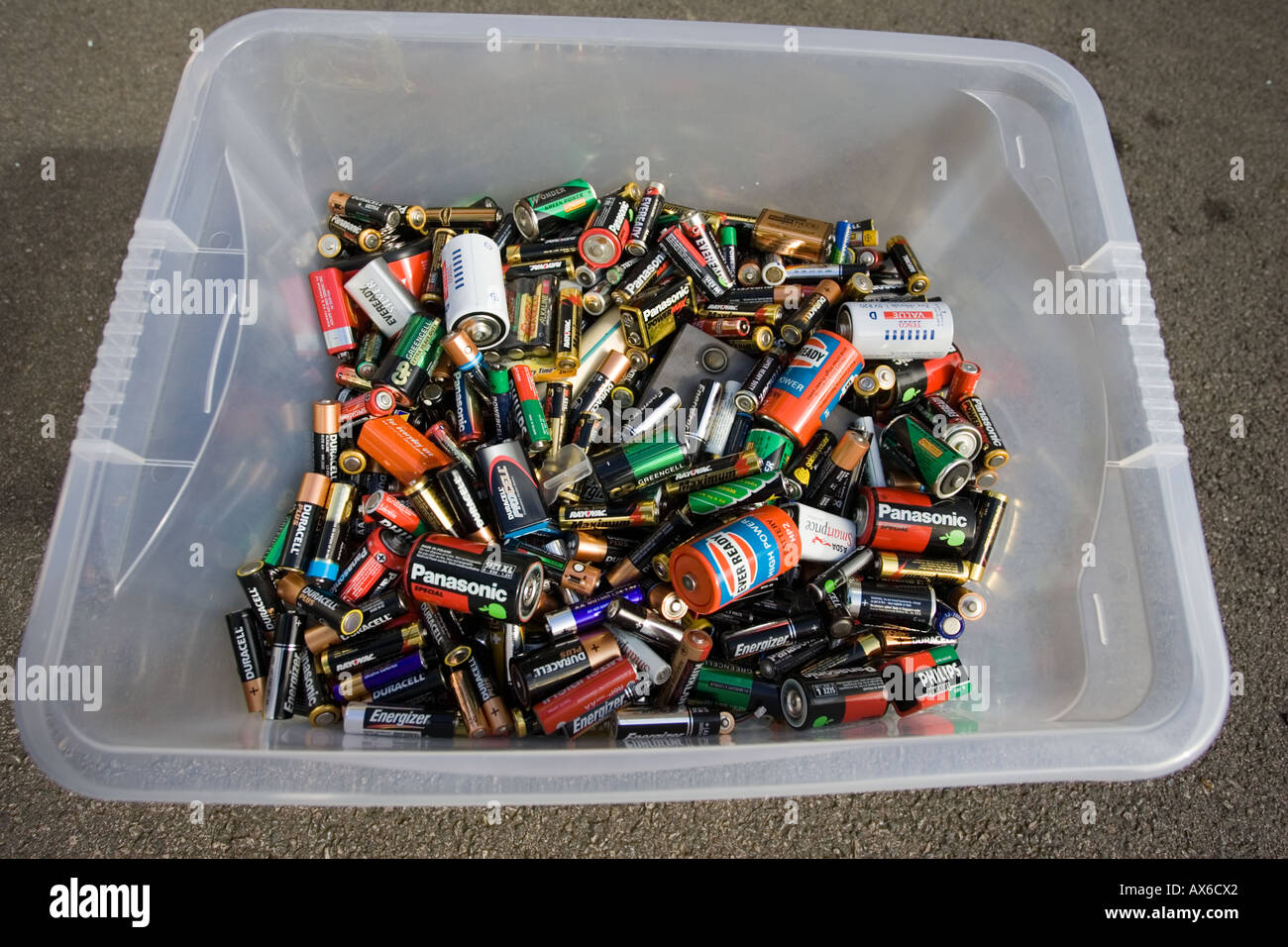 Plastic box with hundreds of used dry batteries collected for recycling ...