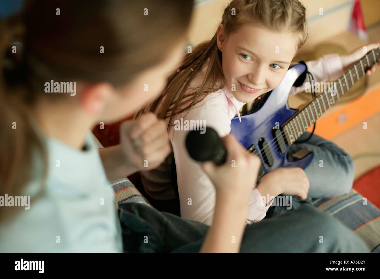 Two friends playing music Stock Photo - Alamy