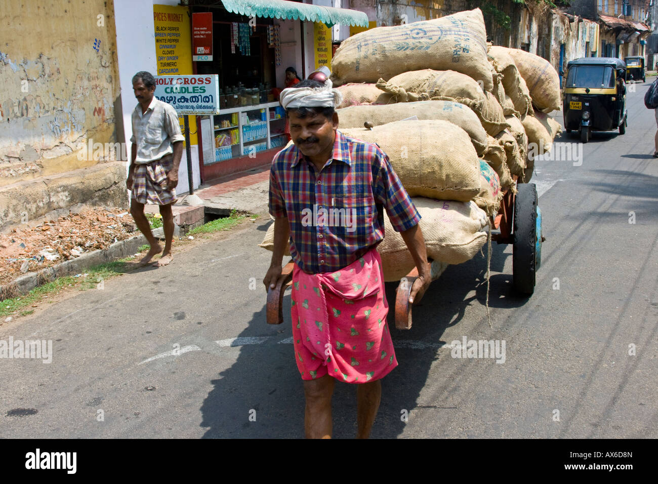 Wheelbarrow man pulling cart hi-res stock photography and images - Alamy