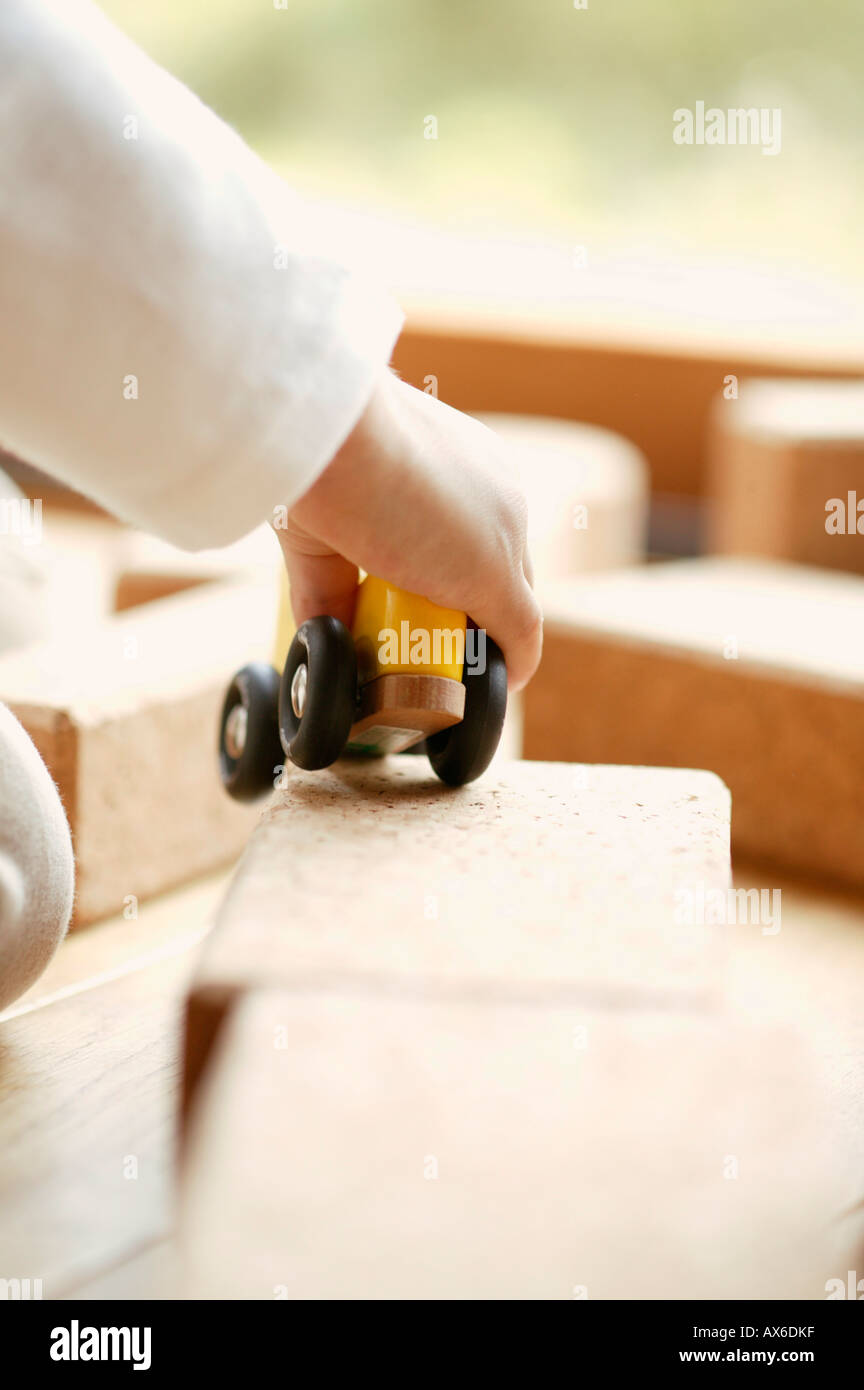 A child running his toy car on rectangular slabs Stock Photo - Alamy
