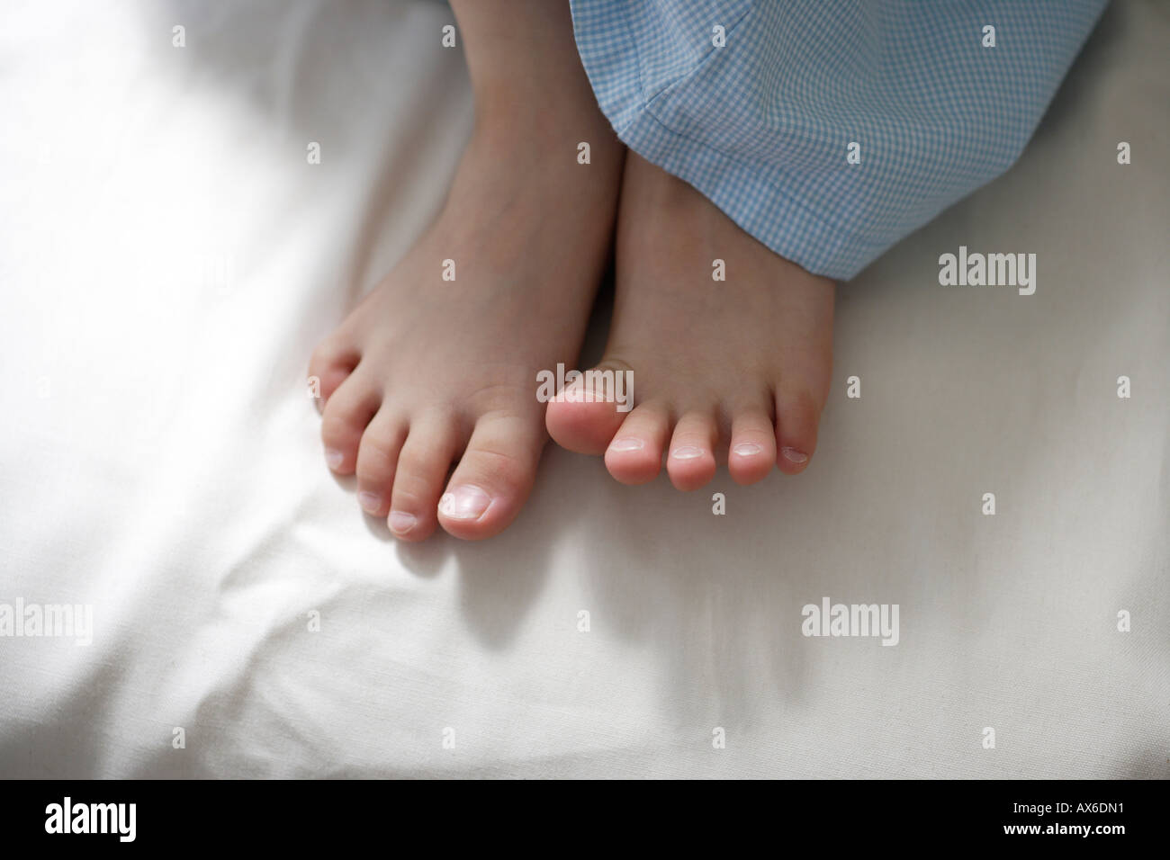 Bear feet of child Stock Photo - Alamy