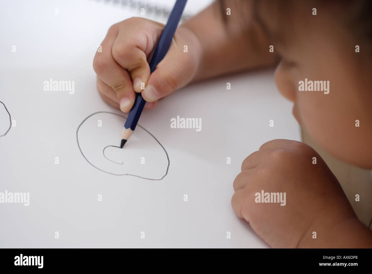 A girl drawing avidly Stock Photo - Alamy