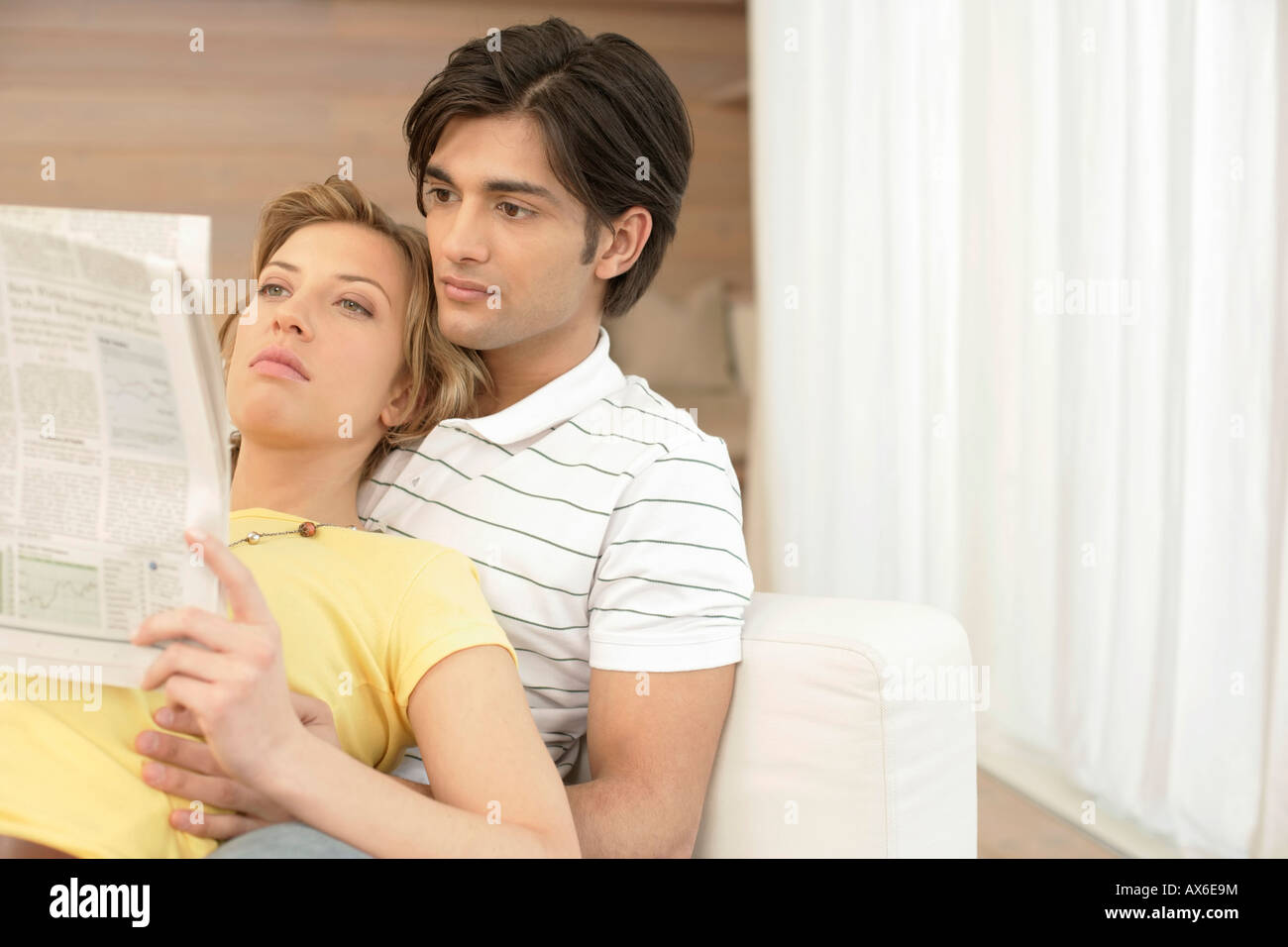 Caucasian couple reading newspaper hi-res stock photography and images ...