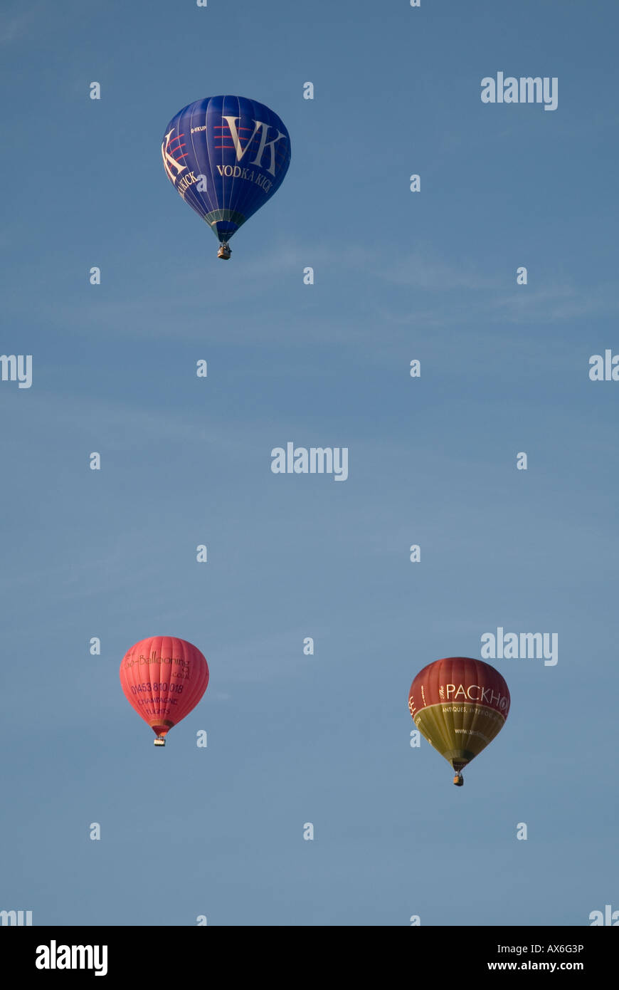 Three colourful hot air balloons in flight Stock Photo - Alamy