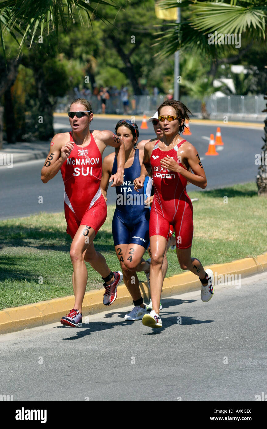 Group of athletes out on the run section of the triathlon course along ...
