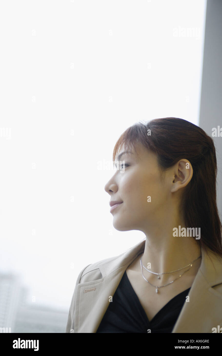 A side view of a woman enjoying the pleasant environment Stock Photo ...