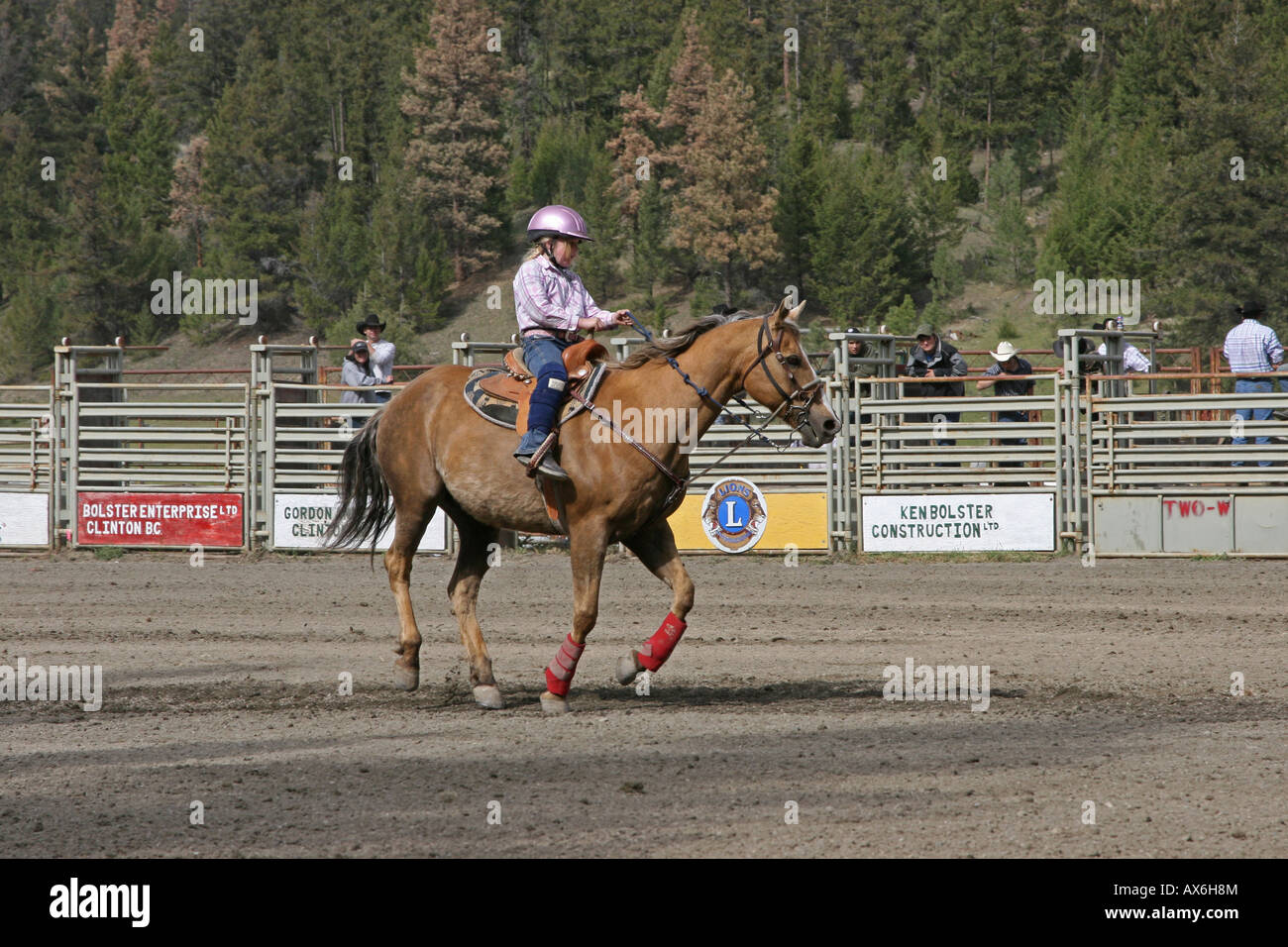 Young girl barrel racing at a rodeo Stock Photo - Alamy