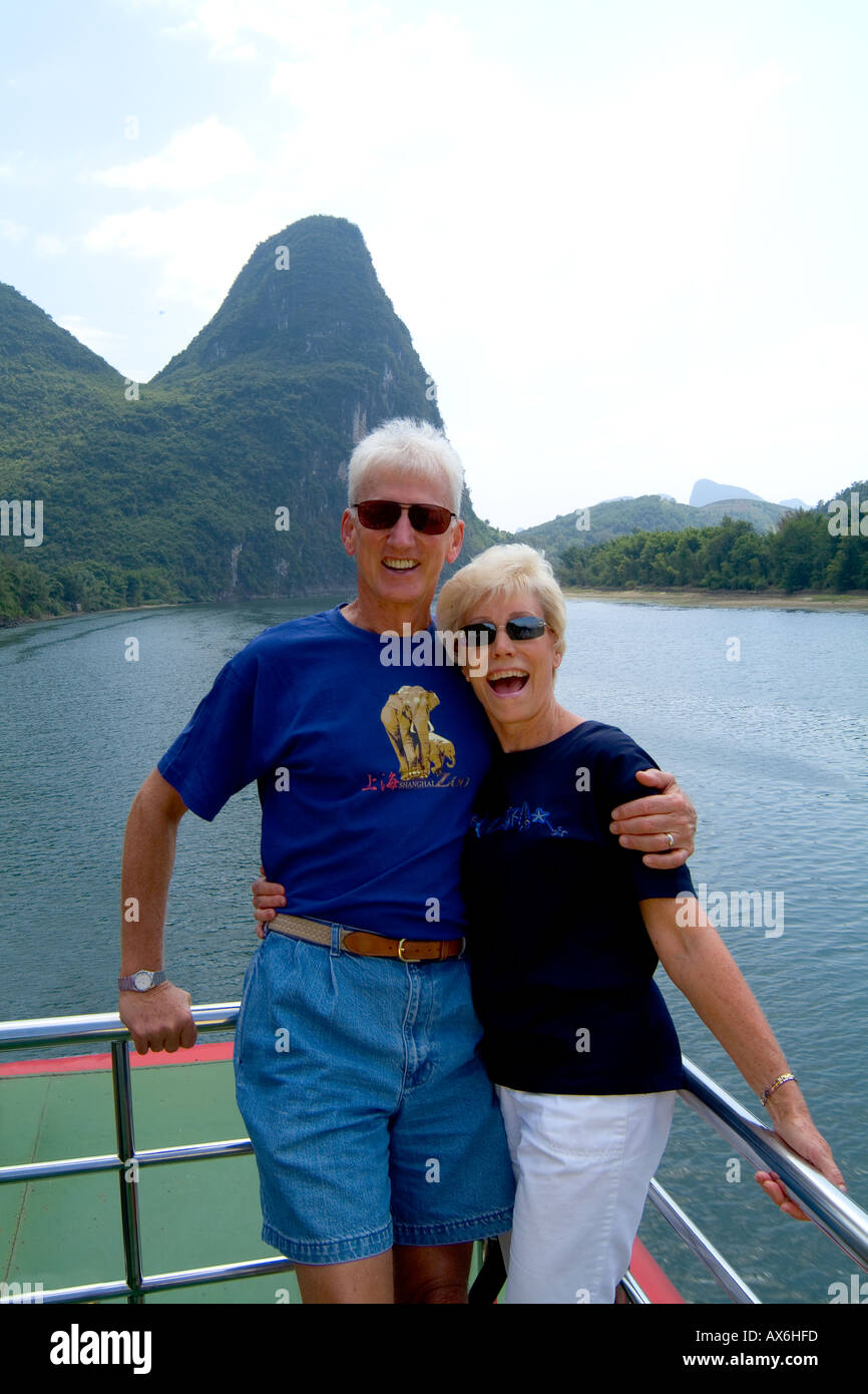 Retired couple cruising the Li River in unique Guilin Yangshuo area of ...