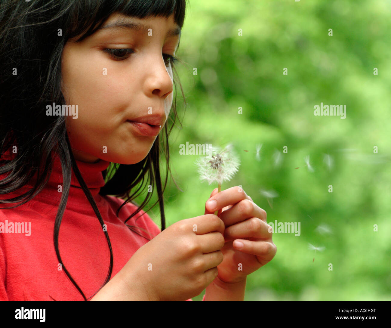 Side view child girl blowing hi-res stock photography and images - Alamy