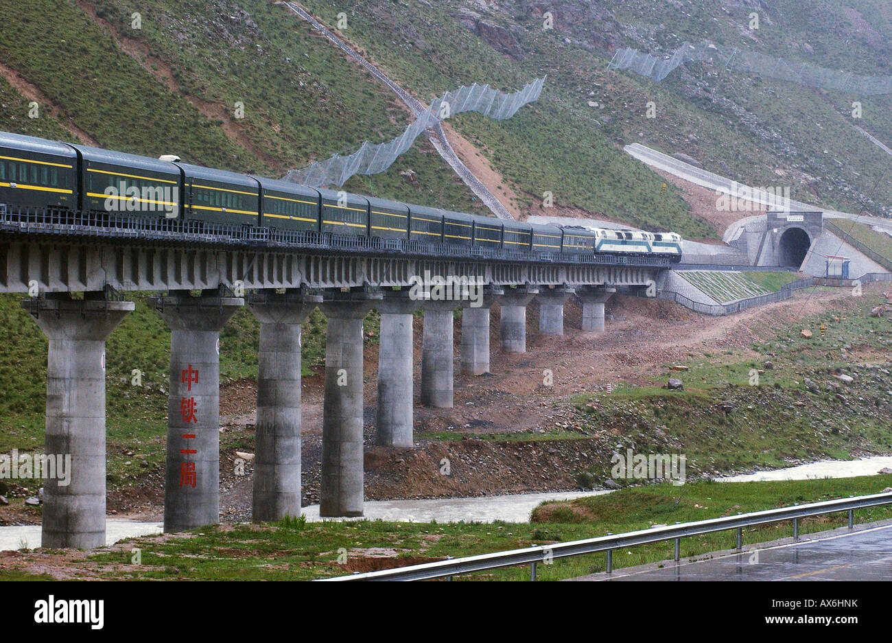 A train passes over a bridge on the Tibet railway, which opened in July ...