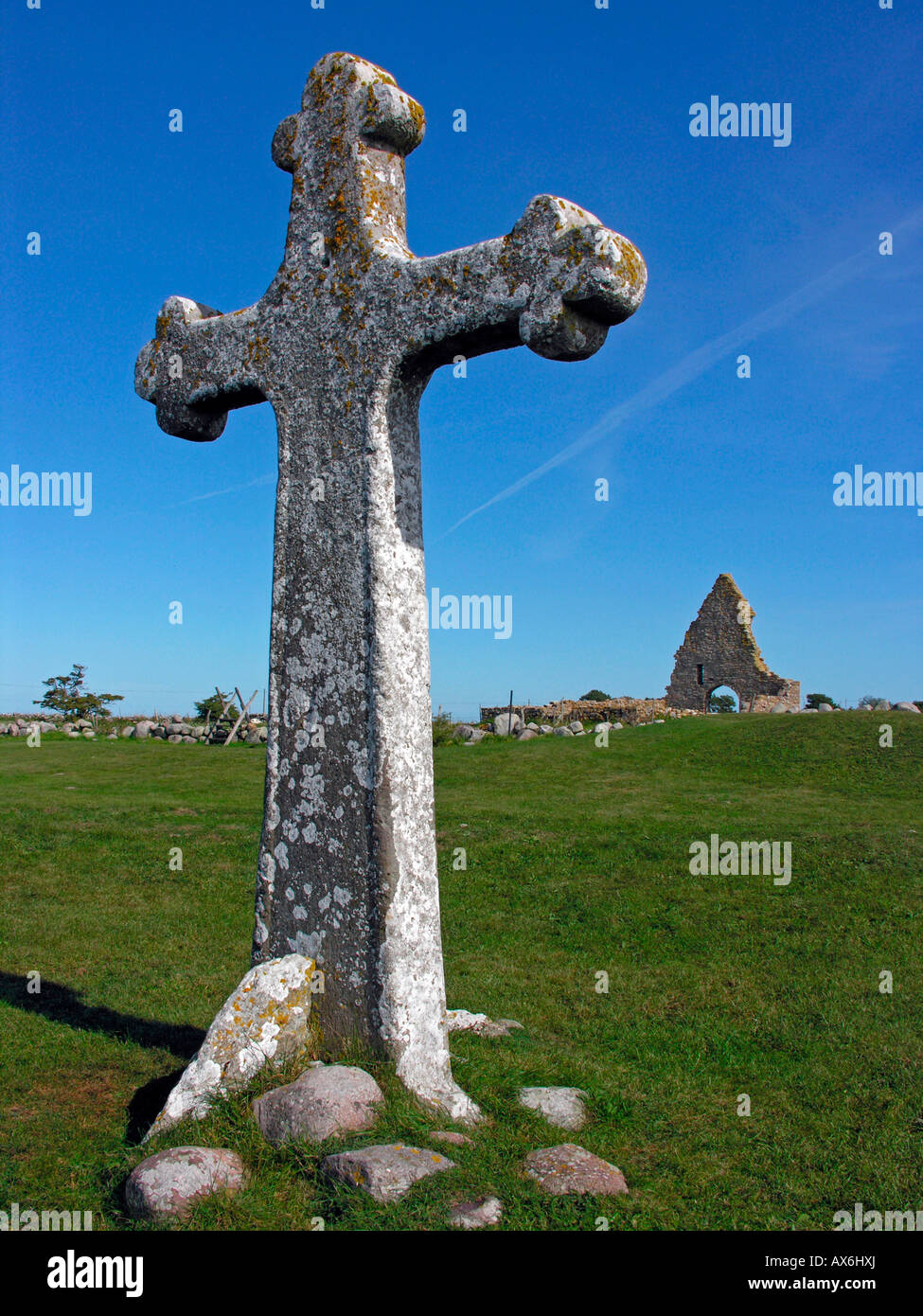 Old cross on landscape with old ruins of chapel in background, Oeland ...