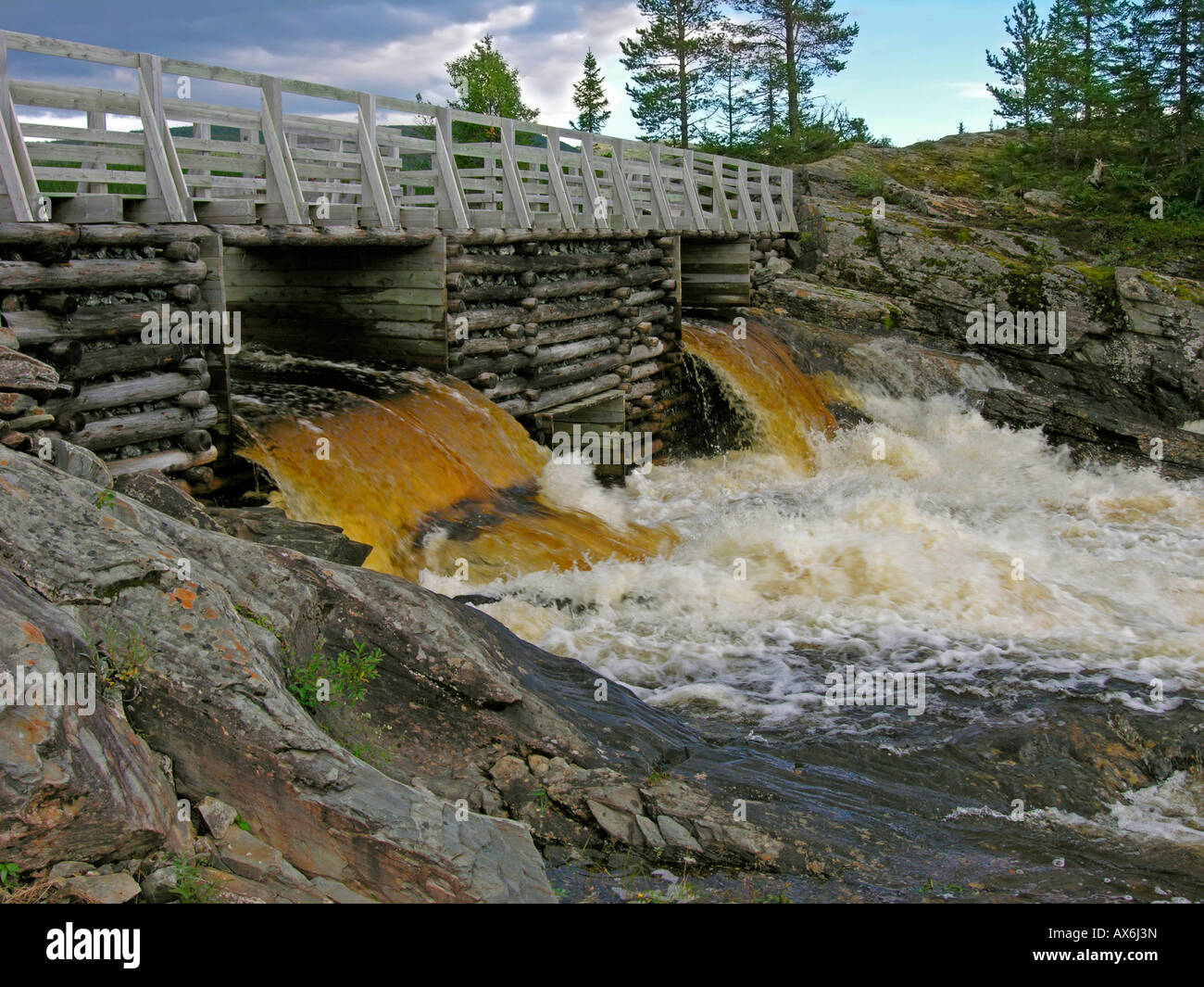 Bridge across river on landscape Stock Photo - Alamy