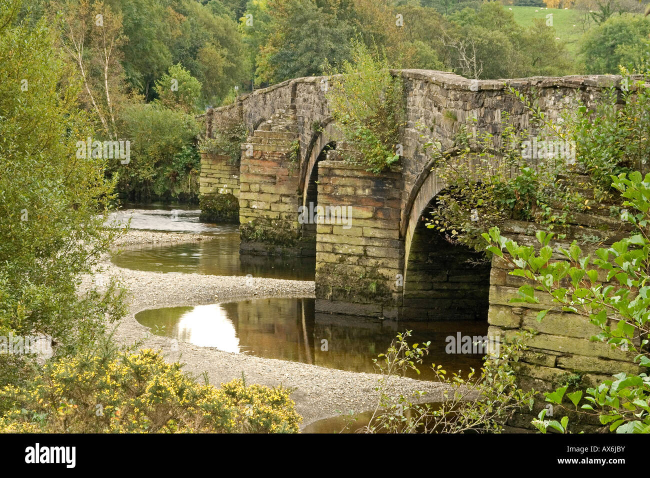 The five arch Llanelltyd Bridge over the river Afon Mawddach in ...