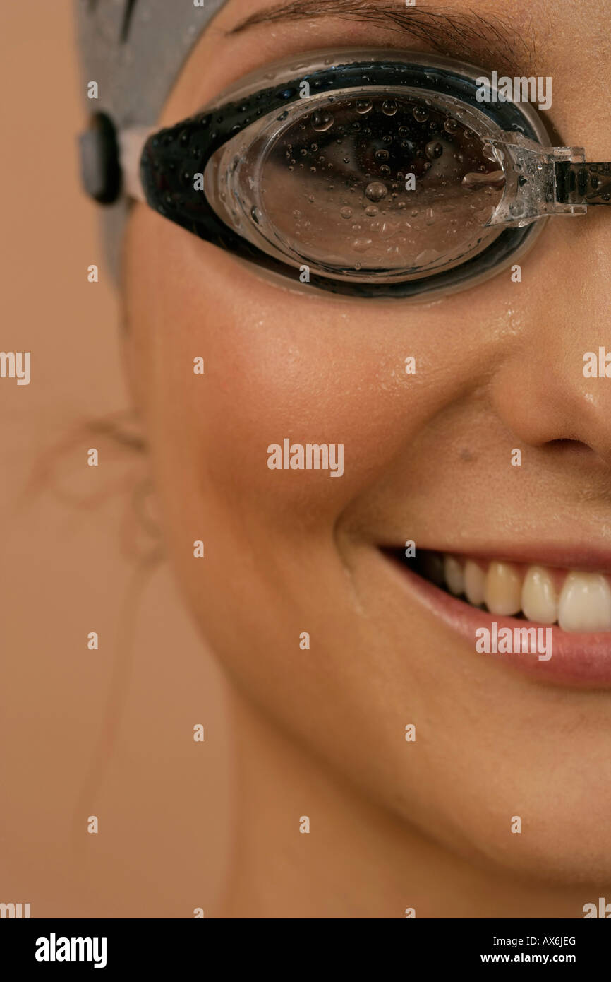 Close-up portrait of a female swimmer wearing goggles Stock Photo - Alamy