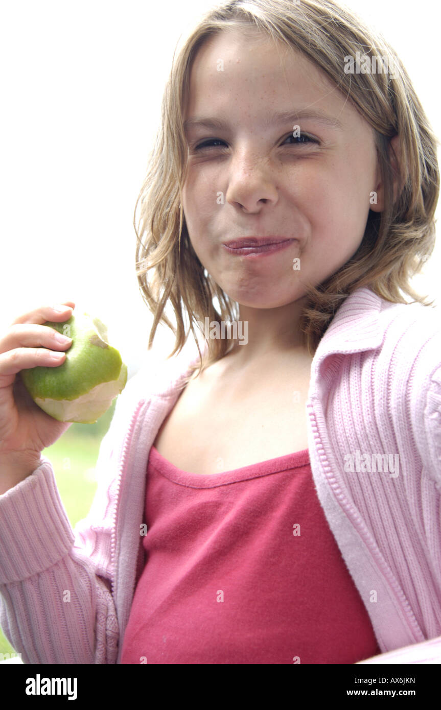 Blonde girl eating apple hi-res stock photography and images - Alamy