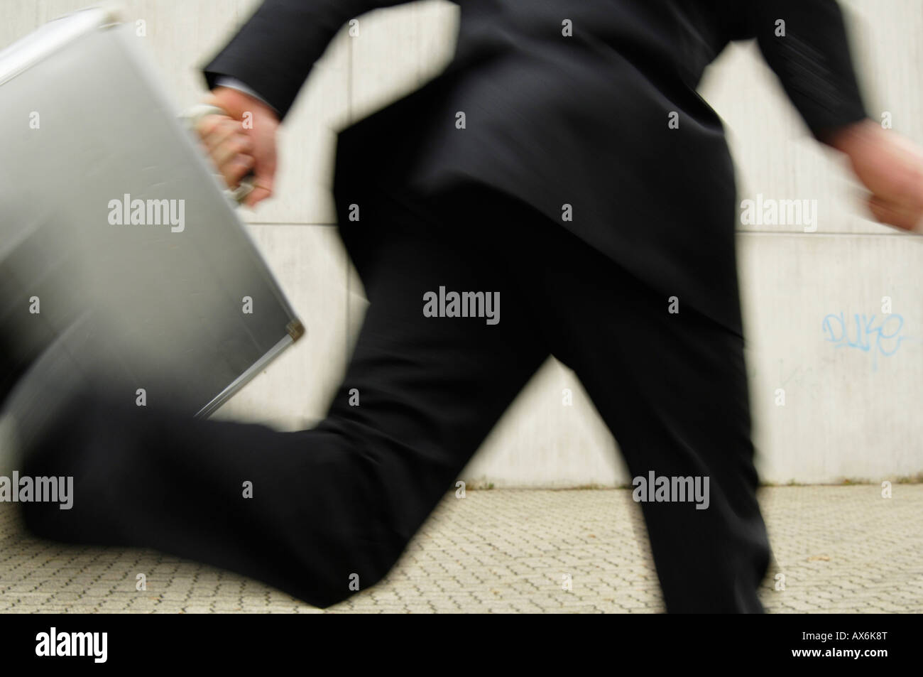 Low section view of businessman running Stock Photo - Alamy