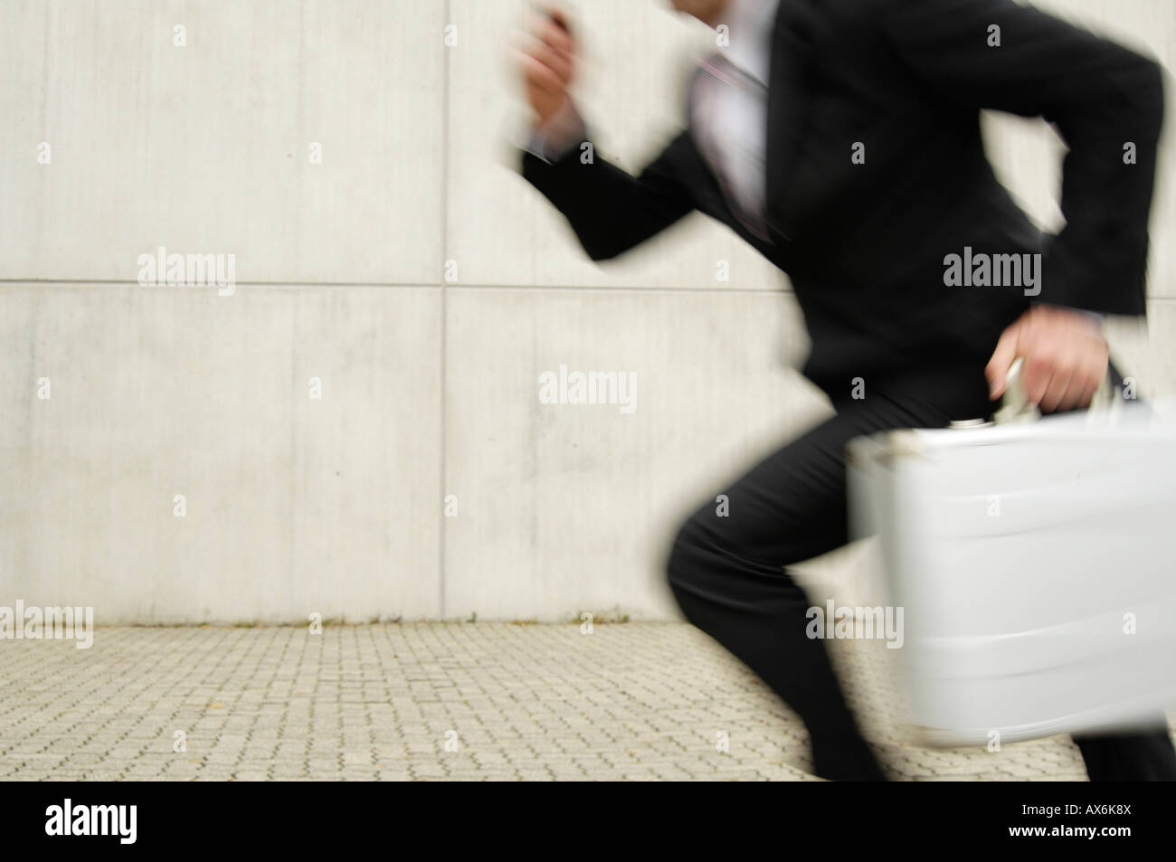 Low section view of businessman running Stock Photo - Alamy