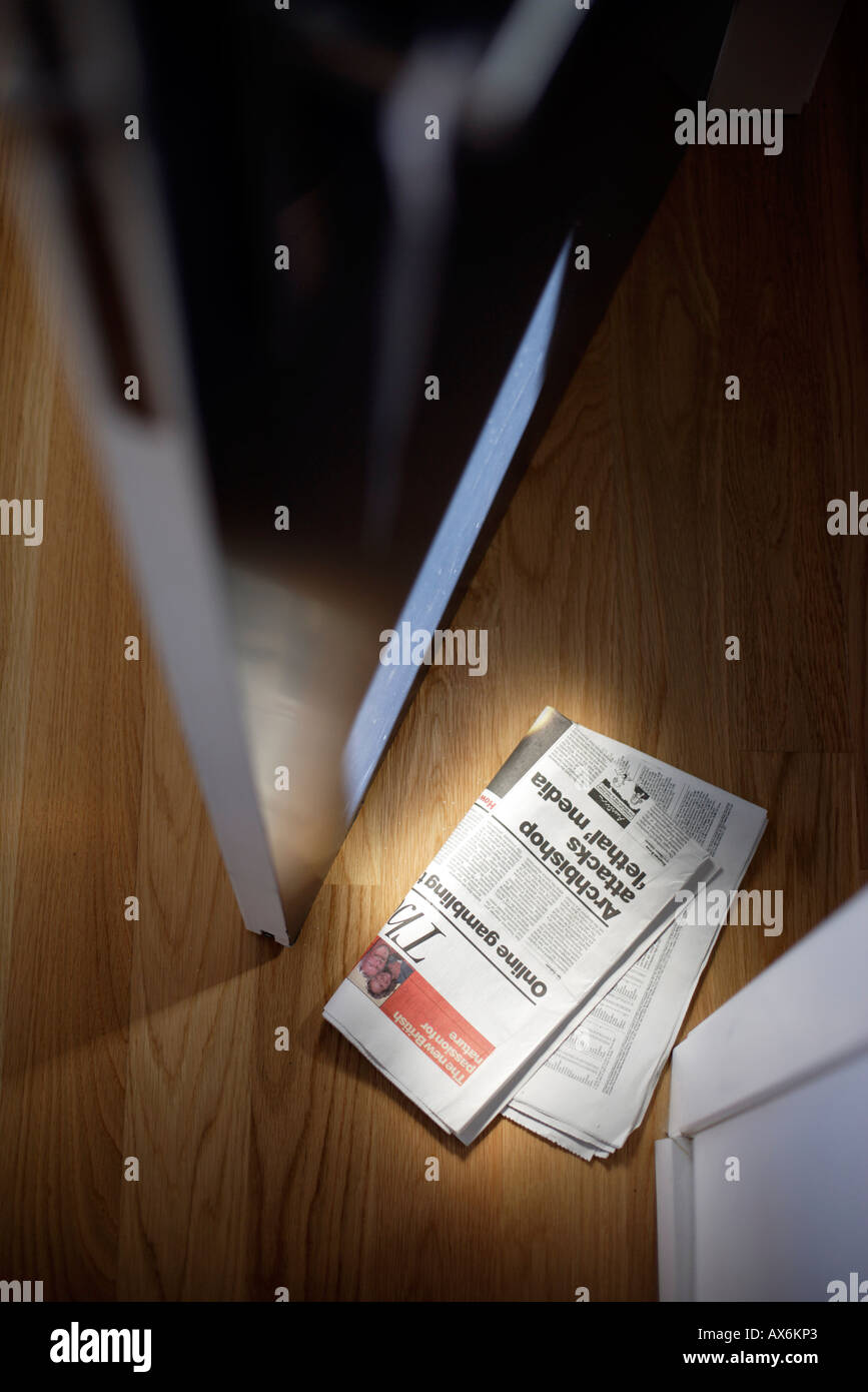 Open newspaper on floor hi-res stock photography and images - Alamy