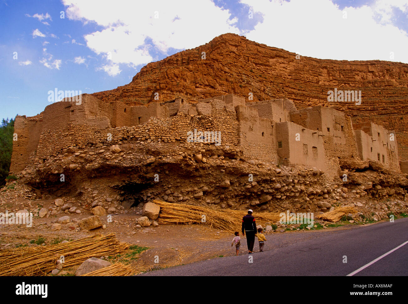 Moroccan people person of color father and sons man boys walking along ...