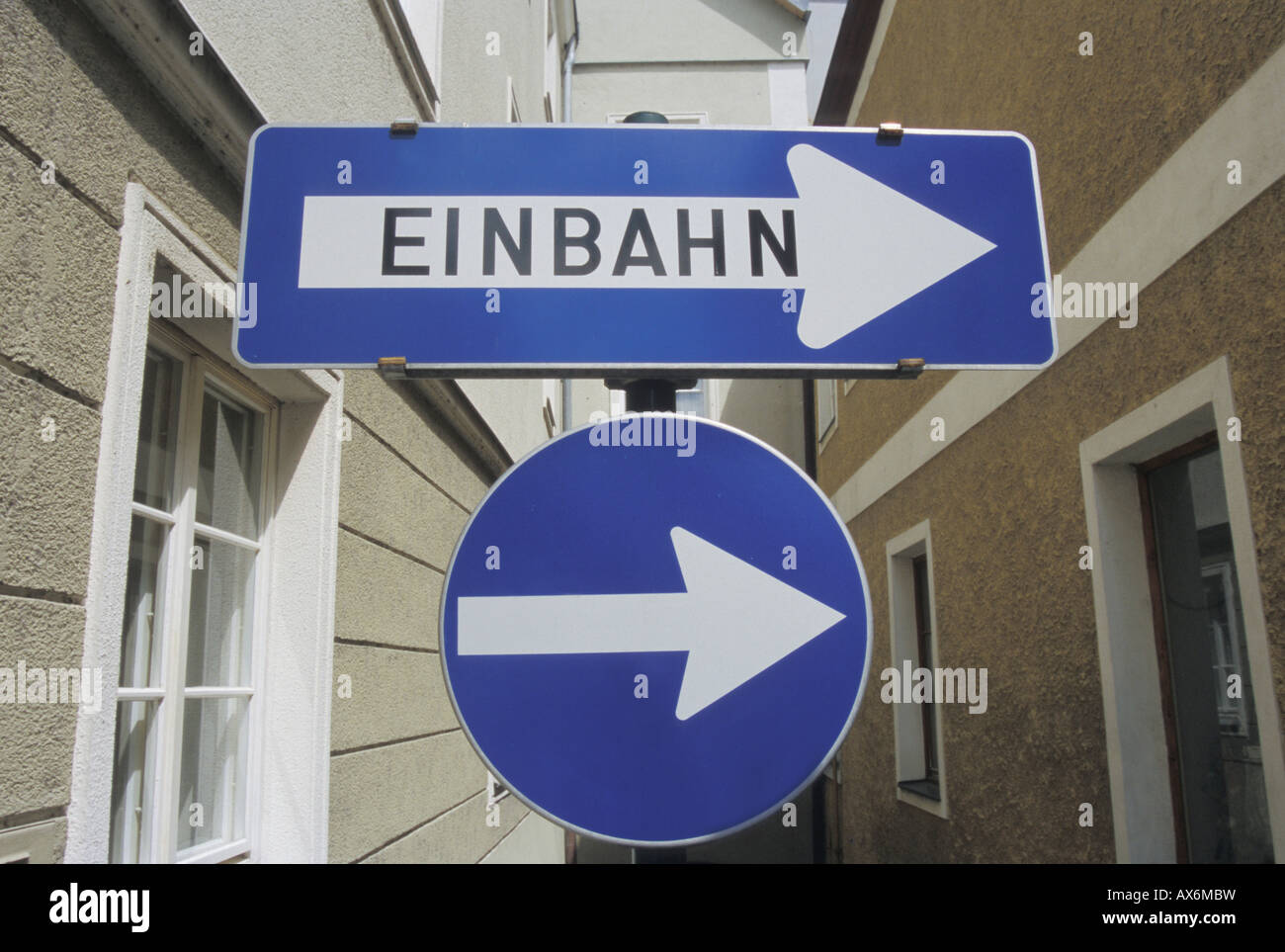 Road sign one-way with direction indicator Stock Photo - Alamy