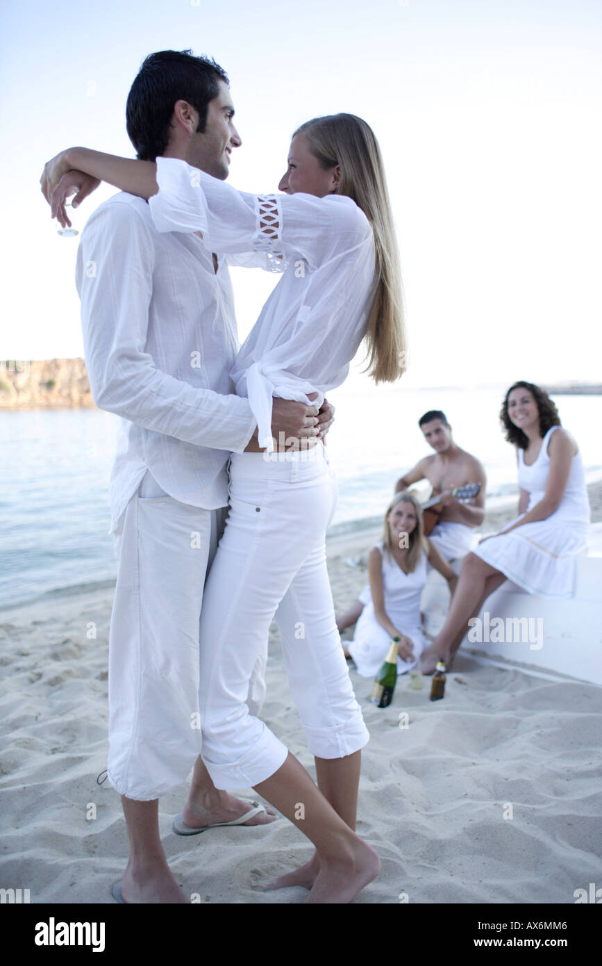 Group of young people at beach party, Mallorca Stock Photo - Alamy