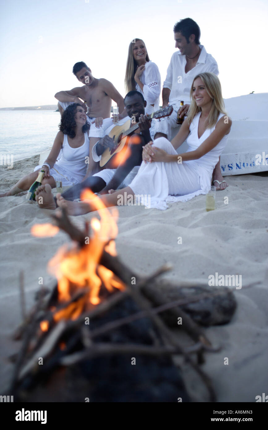 Group of young people at beach party, Mallorca Stock Photo - Alamy