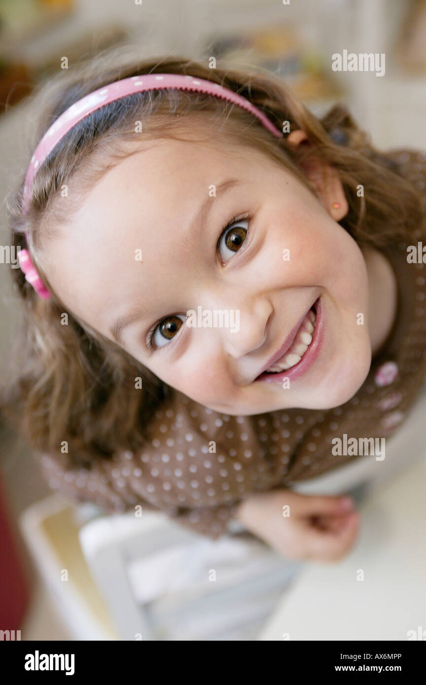 Girl smiling at camera Stock Photo - Alamy