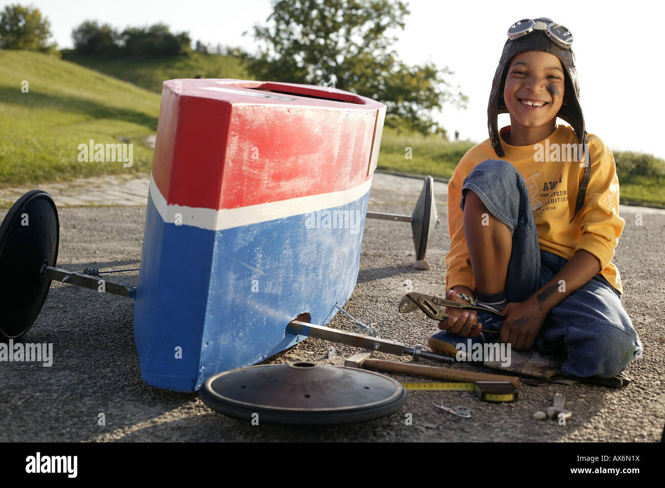 Boy repairing a soap box Stock Photo - Alamy