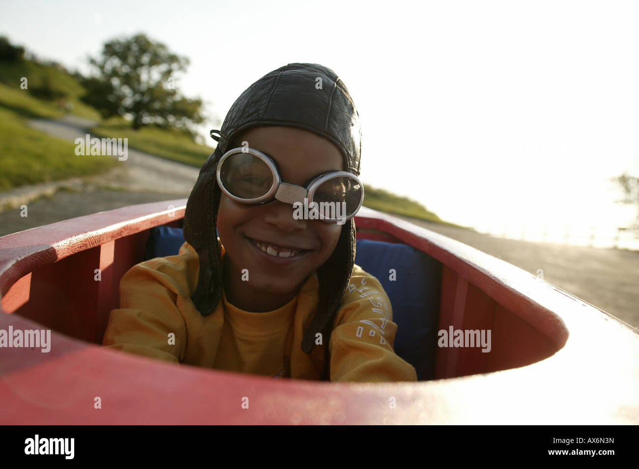 Boy sitting in a soap box Stock Photo - Alamy